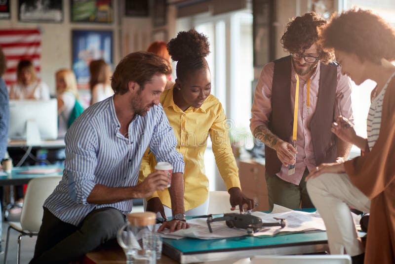 Group of People Considering Possibilities Using the Drone for Filming ...