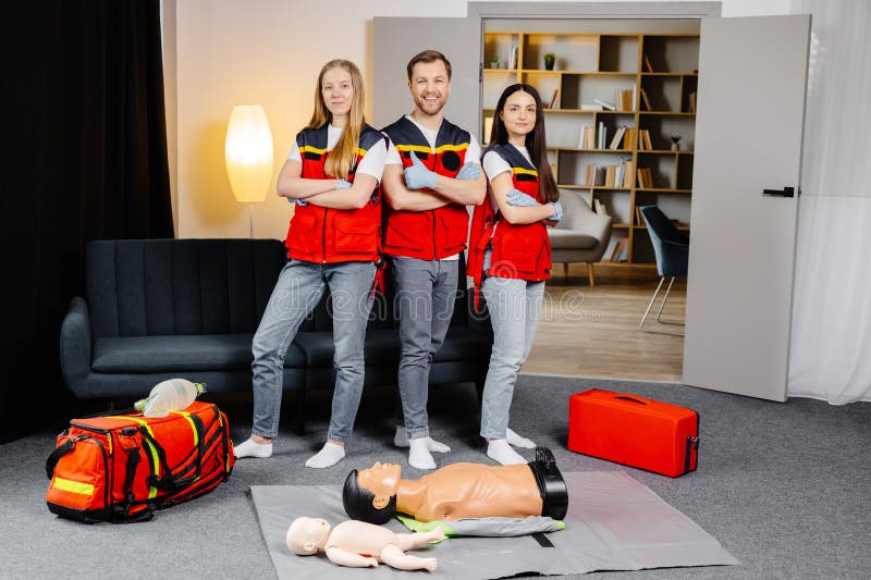Group of People with Cpr Dummy Looking at Camera and Smiling after ...
