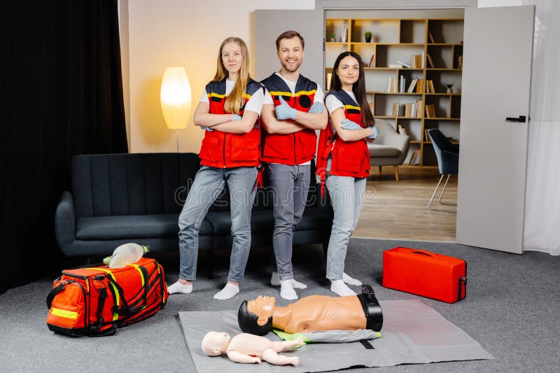 Group of People with Cpr Dummy Looking at Camera and Smiling after ...