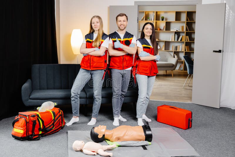 Group of People with Cpr Dummy Looking at Camera and Smiling after ...
