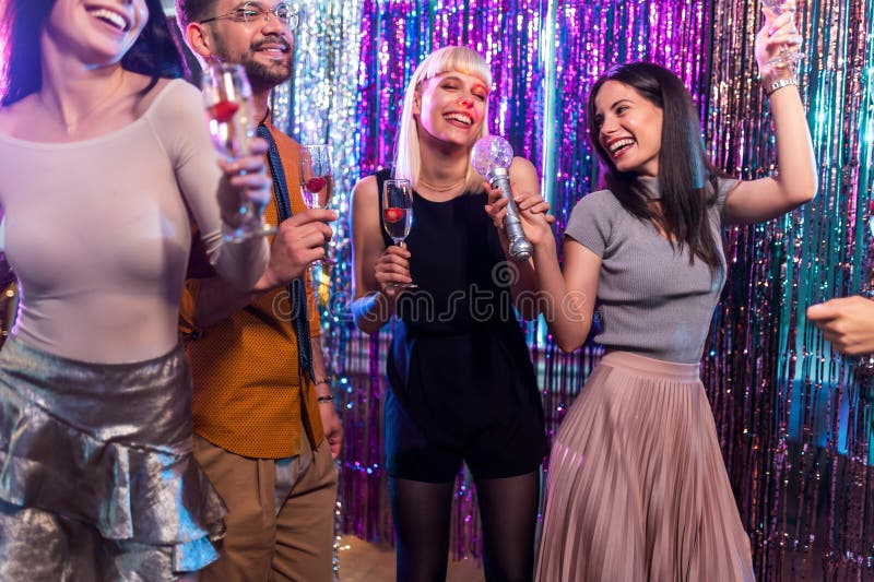 People Dancing in the Club Singing Karaoke Stock Photo - Image of disco ...
