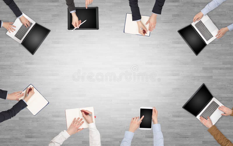 Group of People with Devices in Hands Having Desk Discussion and ...