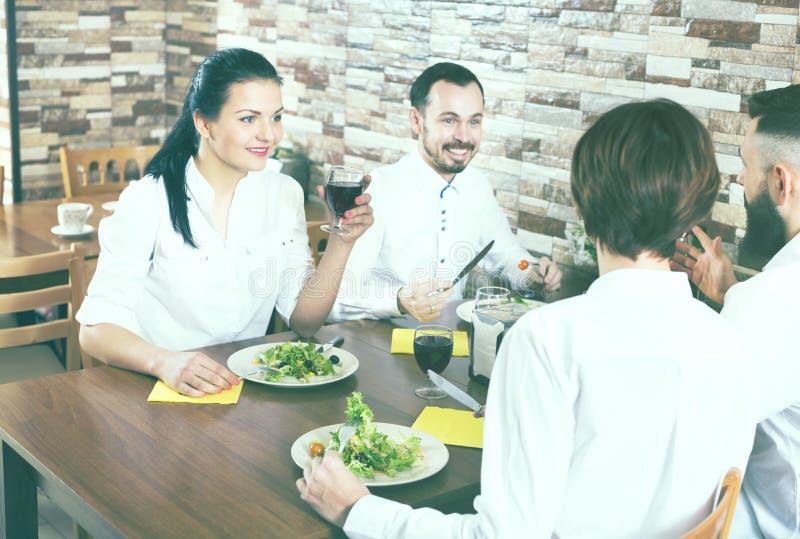 Group of People Dining Out in Restaurant Stock Photo - Image of females ...