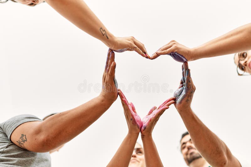Group of People Doing Heart Sign with Hands Together at Art Studio ...