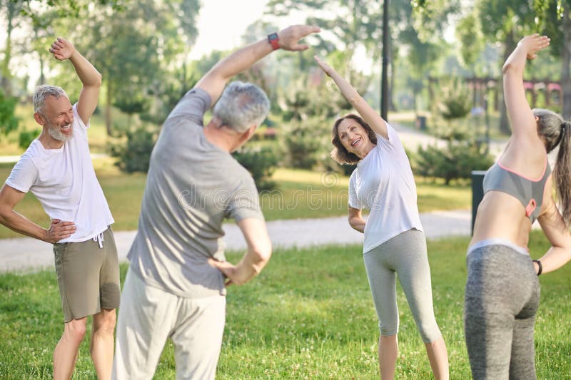 Group of People Doing Morning Exercises in the Park Stock Photo - Image ...