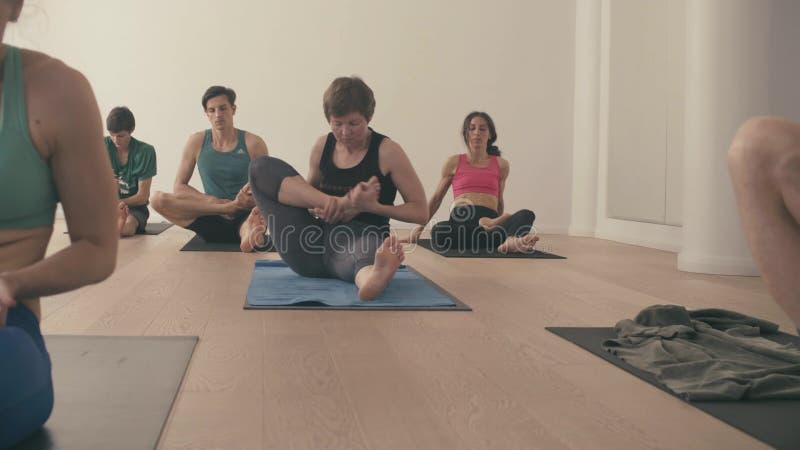 Group of People Doing Yoga Asanas in Studio Stock Video - Video of ...