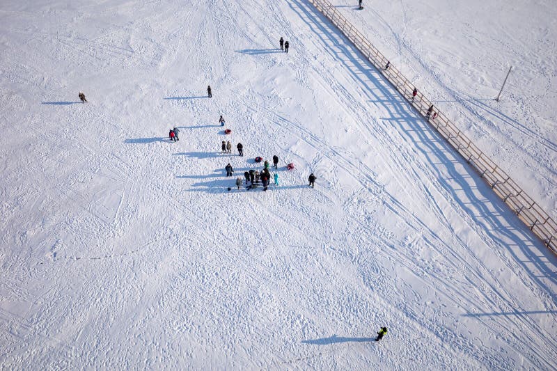 A Group of People Down in the Snow in an Open Space Bird S-eye View ...