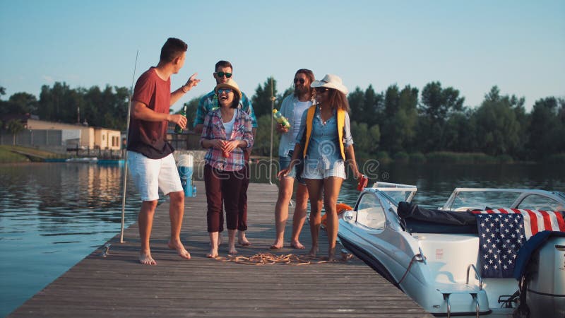 Group of People with Drinks on Pier Stock Image - Image of pier ...