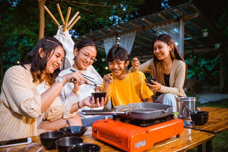 The Group of People Eating Grilled Beef Together Stock Photo - Image of ...
