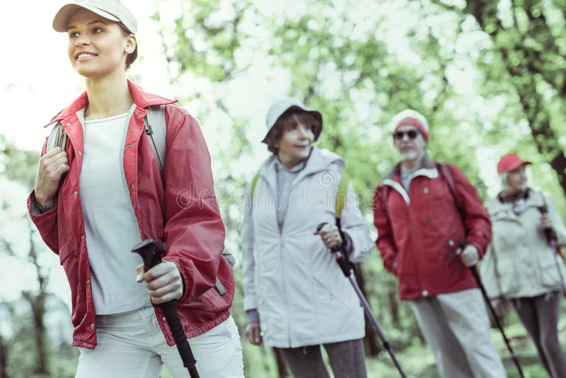 Group of People Enjoying the Outdoor Walk in the Forest Stock Image ...