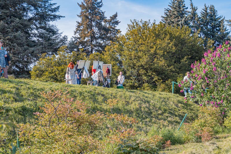 A Group of People Gather on a Hillside for an Outdoor Activity ...