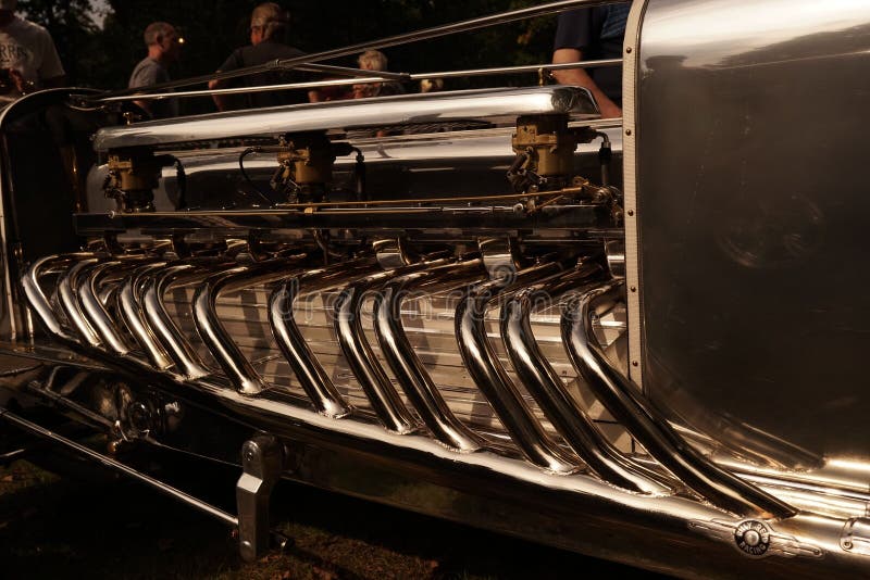 Group of People are Gathered Around a Large Chrome Car Engine Editorial ...