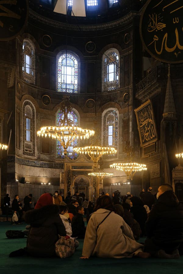 Group of People are Gathered in a Large, Illuminated Religious Building ...
