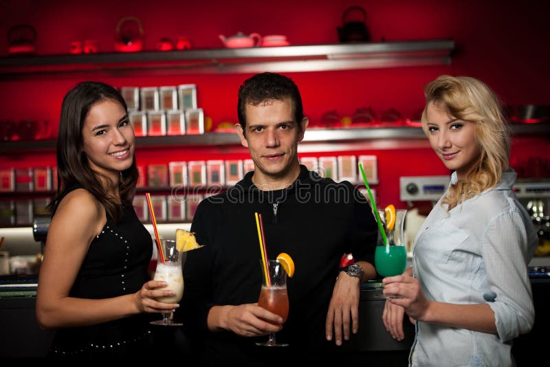 Two Beautiful Women Drinking Cocktail in a Night Club and Having Stock ...