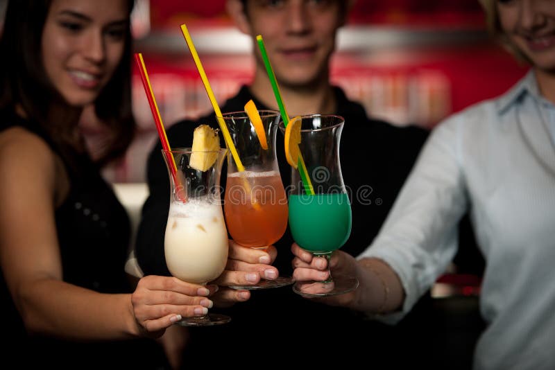Group of People Gathering in Cocktail Bar and Having Fun Stock Photo ...