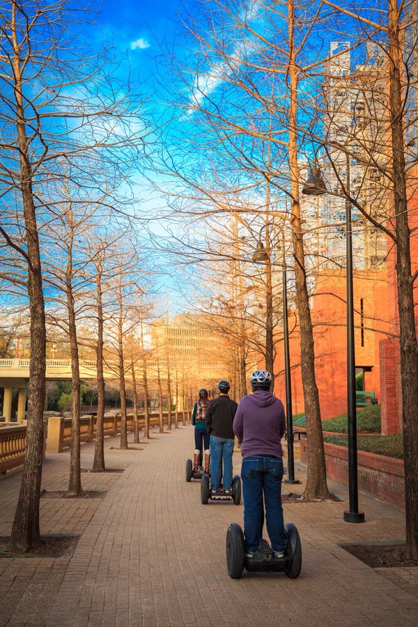A Group of People Go on the Same Way, on Two Wheel Electric Devi ...