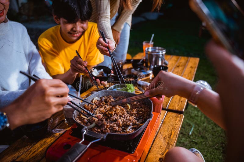 The Group of People Grilling the Beef and the Onions Stock Image ...