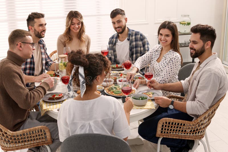Group of People Having Brunch Together at Table Indoors Stock Image ...