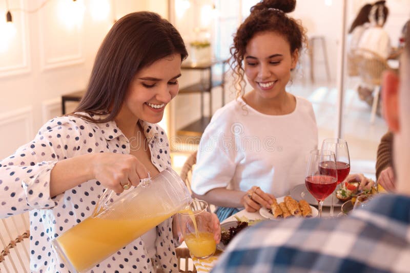 Group of People Having Brunch Together at Table Indoors Stock Image ...