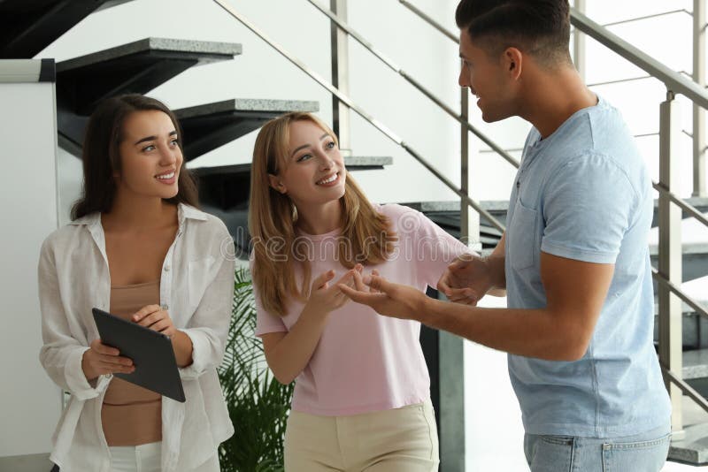 Group of People Having Conversation in Hall Stock Photo - Image of ...