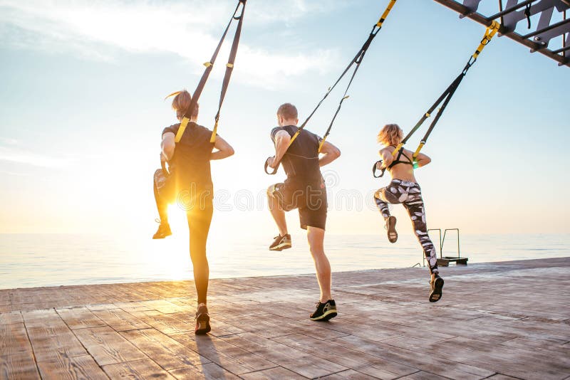 Group of People Having Trx Training Stock Photo - Image of stretch ...