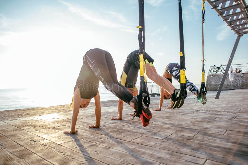 Group of People Having Trx Training Stock Photo - Image of stretch ...