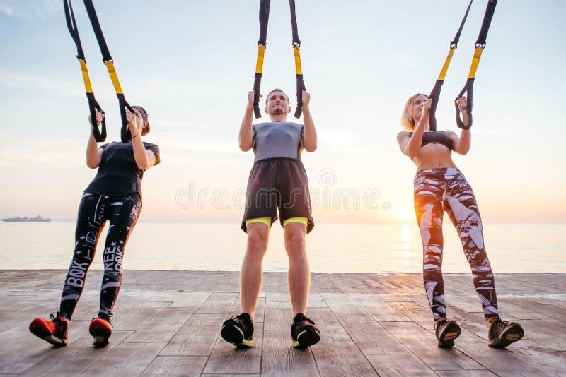 Group of People Having Trx Training Stock Photo - Image of stretch ...