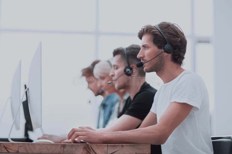 Group of People in the Headset Works on Personal Computers. Stock Image ...