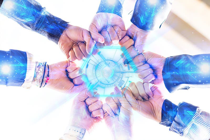 A Group of People are Holding Hands in a Circle Around a Blue Object ...