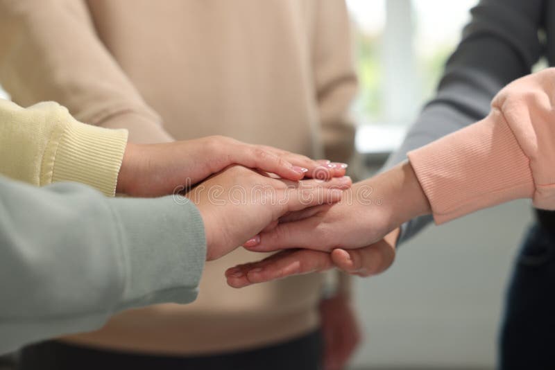 Group of People Holding Hands Together Indoors, Closeup. Unity Concept ...