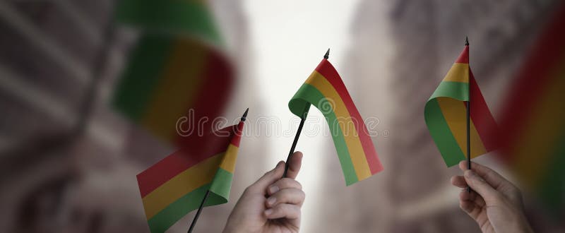 A Group of People Holding Small Flags of the Bolivia in Their Hands ...