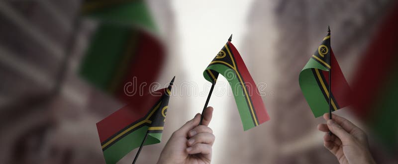 A Group of People Holding Small Flags of the Vanuatu in Their Hands ...