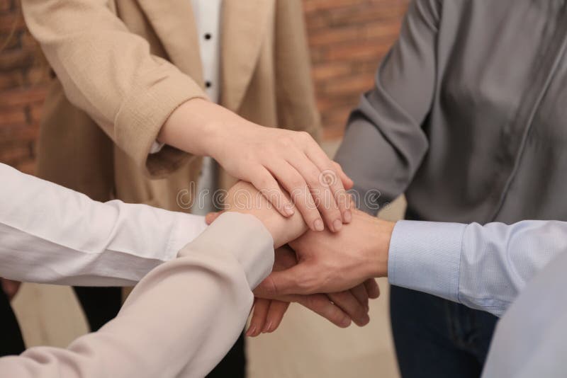 Group of People Holding Their Hands Together Indoors Stock Image ...