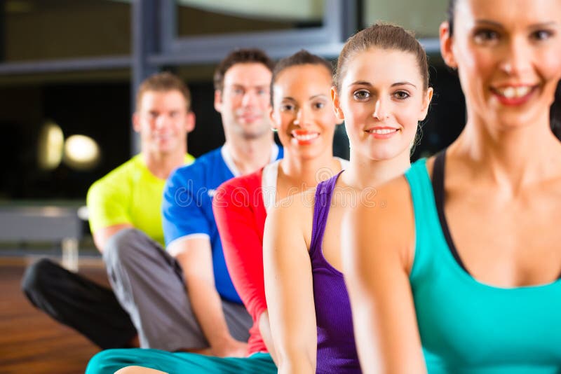 Group of People and Instructor in Gym Stretching Stock Image - Image of ...