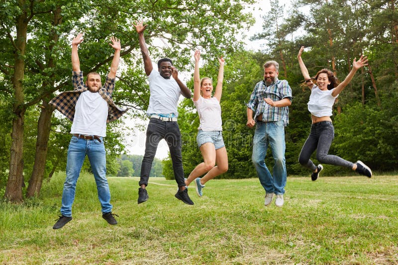 Group of People while Jumping in the Nature Stock Image - Image of ...