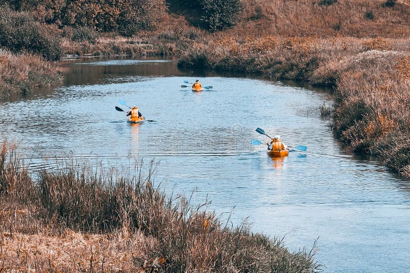 A Group of People are Kayaking on the River. Partying and Camping Stock ...