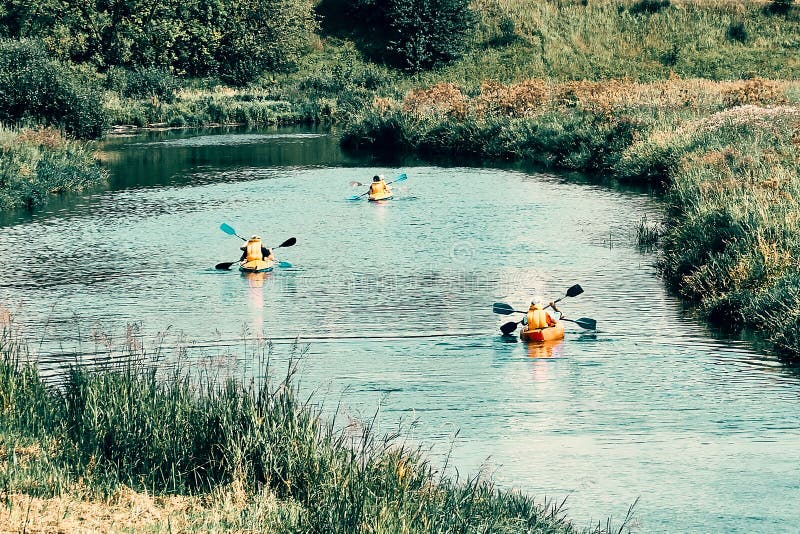 A Group of People are Kayaking on the River. Partying and Camping Stock ...