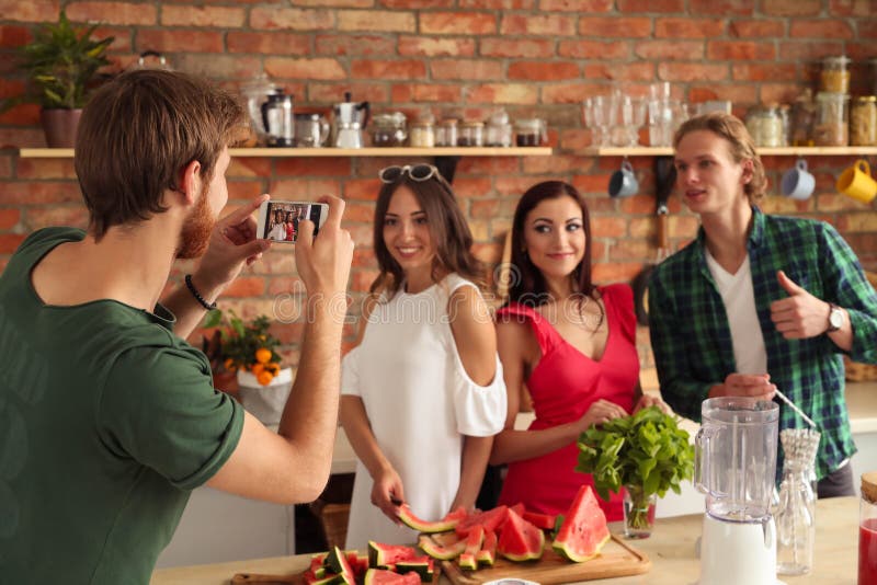 People at kitchen stock image. Image of group, phone - 99765067