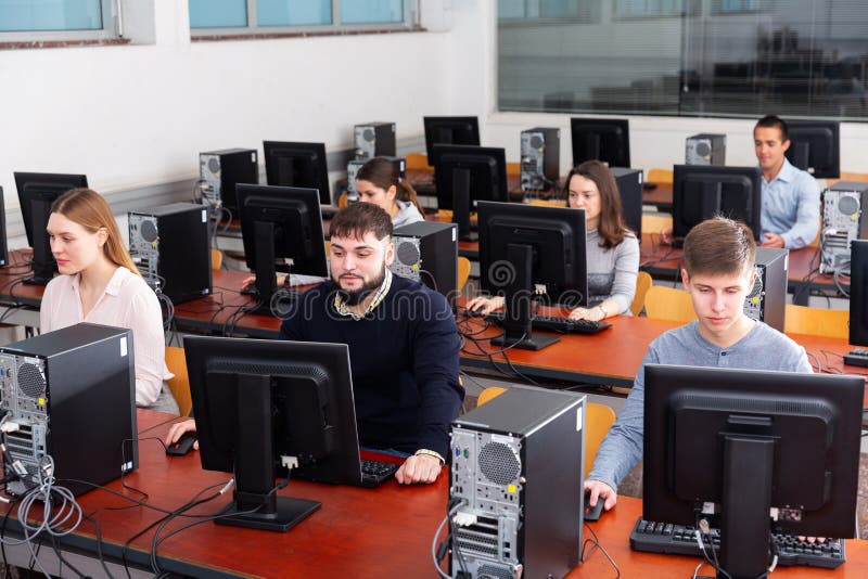 Group of People Learning To Use Computers in Classroom Stock Photo ...
