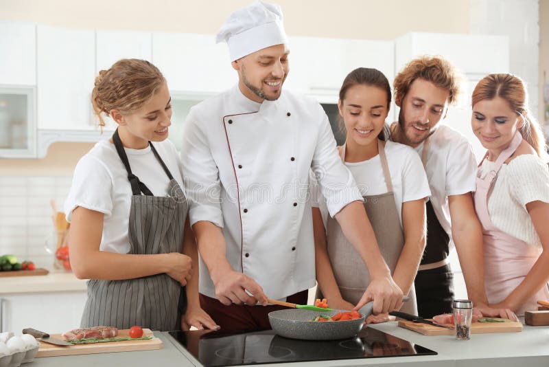 Group of People and Male Chef Stock Photo - Image of aprons, chef ...