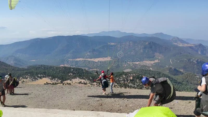 Group of People with Parachutes and Doing Paragliding from Over ...