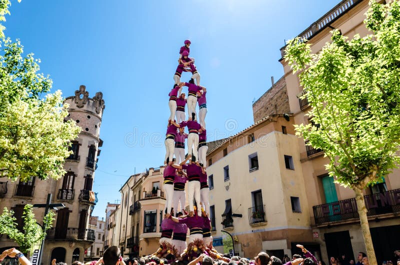 Group of People Performing Stunts, Making a Tower while Standing on ...