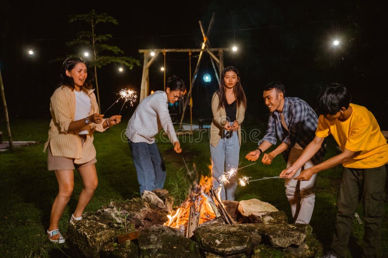 A Group of People Playing the Firework Happily Stock Image - Image of ...
