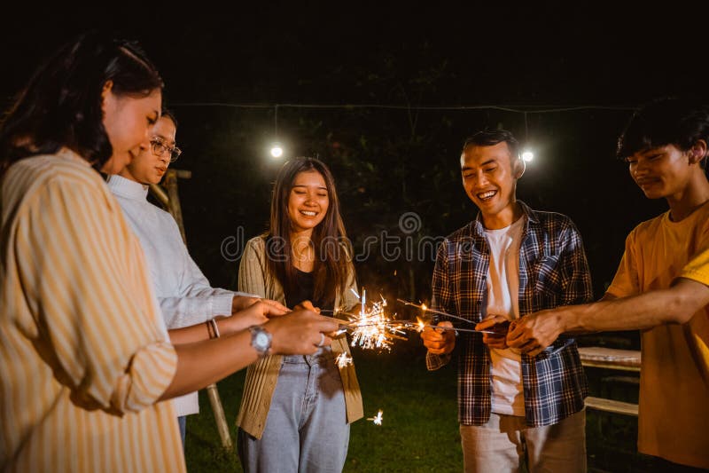 A Group of People Playing with the Fireworks Happily while Camping ...