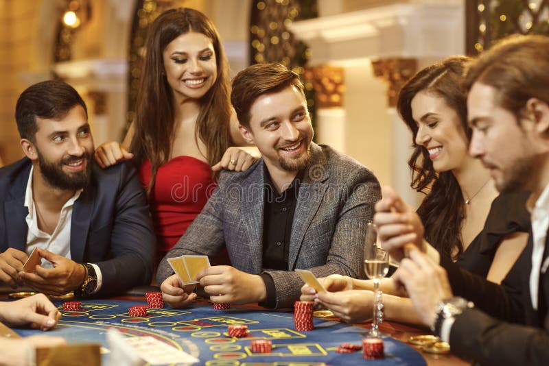 A Group of People Playing Gambling in a Casino Stock Image - Image of ...