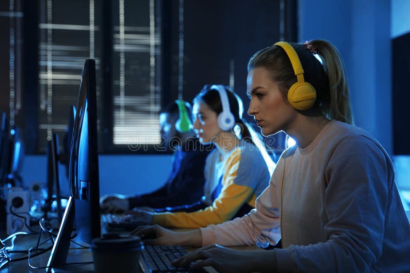 Group of People Playing Video Games in Cafe Stock Photo - Image of ...