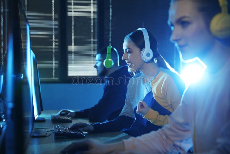 Group of People Playing Video Games in Cafe Stock Image - Image of ...