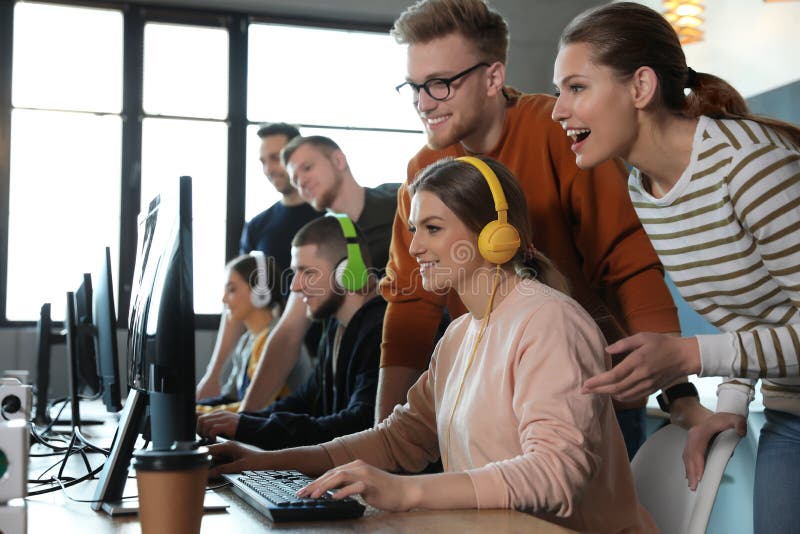 Group of People Playing Video Games in Cafe Stock Image - Image of ...