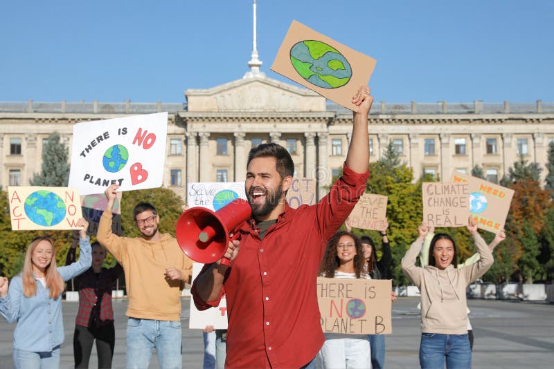 Group of People with Posters Protesting Against Climate Change on City ...