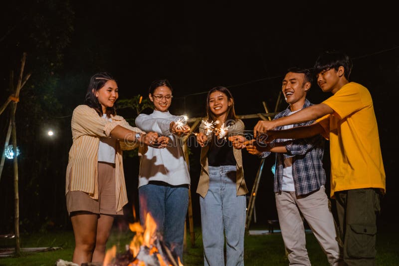 A Group of People Put Their Fireworks Together Stock Photo - Image of ...